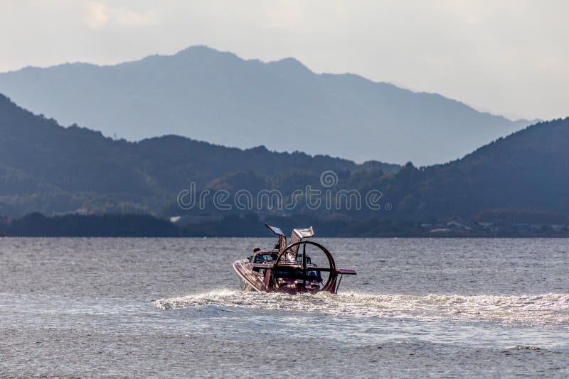 Speed boat on Lake stock photo. Image of speed, mountain - 204814458
