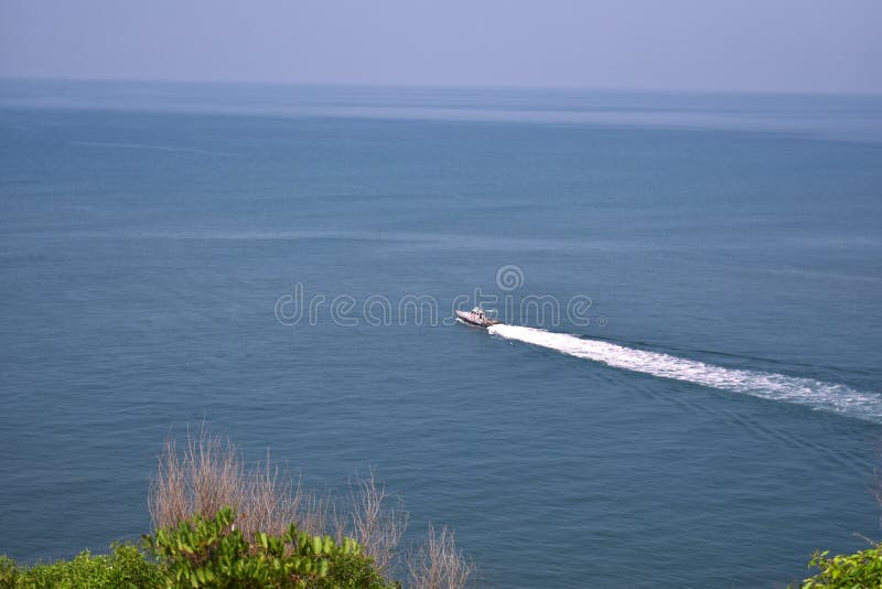 A Speed Boat Moving Forward Leaving a White Trail Behind, Far in the ...