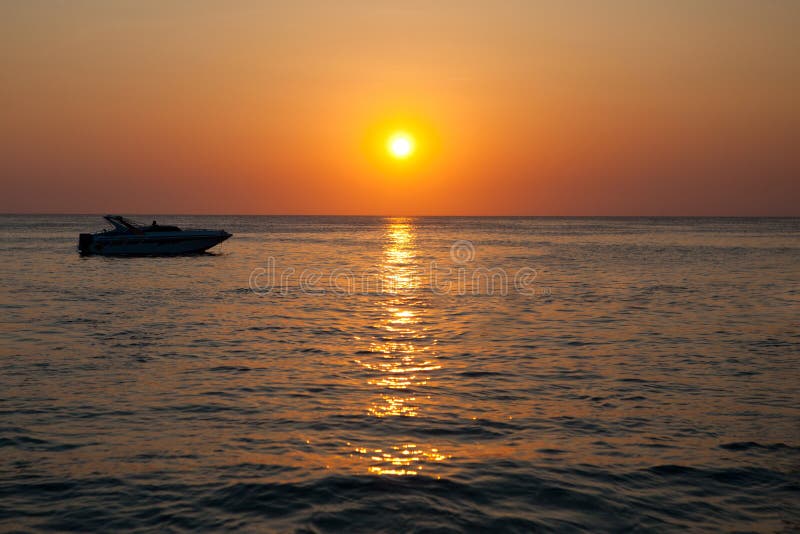 Speed boat in the sea stock image. Image of yellow, sunset - 56429389