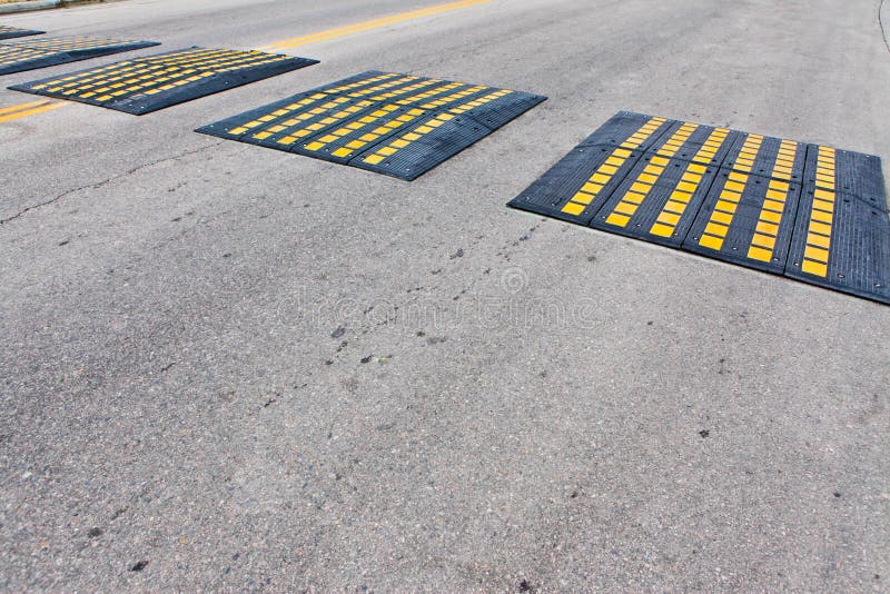 Speed Bump And Road Markings On The Pavement. Stock Photo - Image of ...