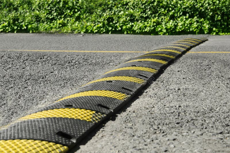 Speed Bump on Empty Asphalt Road. Traffic Calming Stock Photo - Image ...