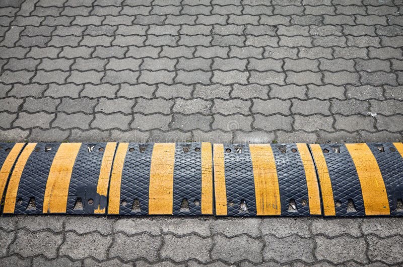 Speed Bump on a Paved Road. Stock Image - Image of line, rubber: 116121941
