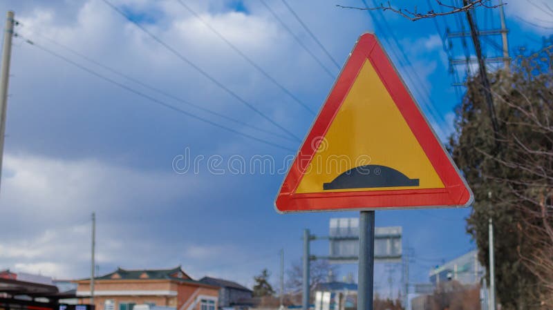 Speed bump road sign board stock image. Image of cable - 368157981