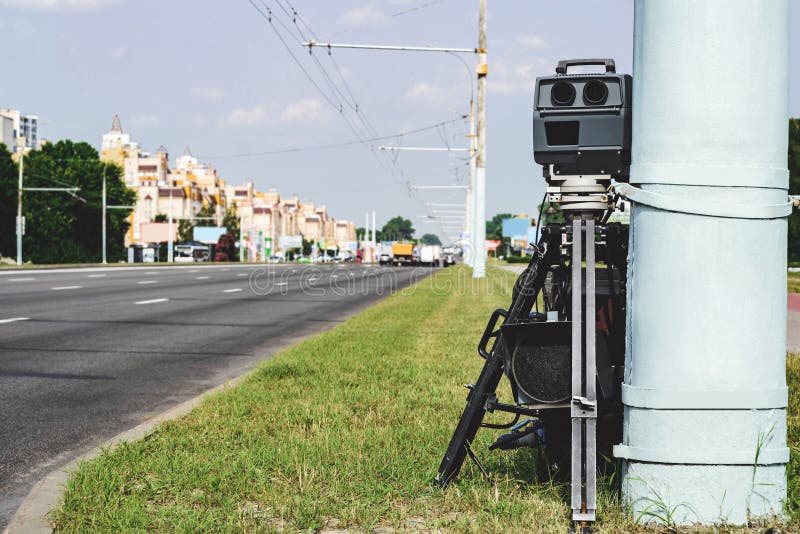 A Speed Camera Stands Near a Pole on the Background of the Road Stock ...