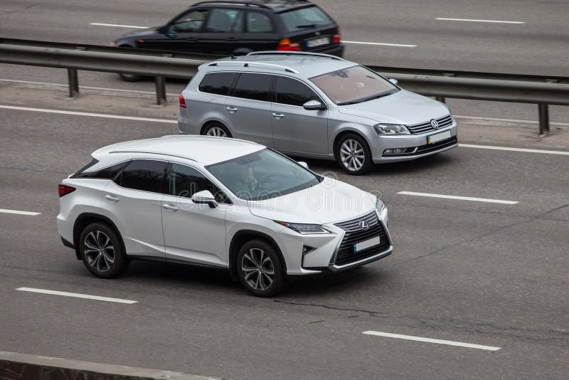 Luxury Car White Lexus Vs Silver VW Speeding on Empty Highway Editorial ...