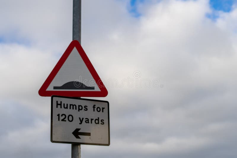 A speed hump warning sign stock photo. Image of road - 171711672