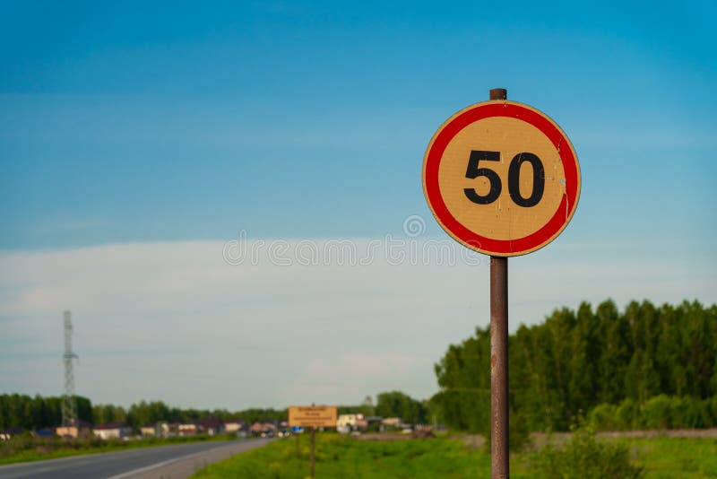 50 Speed Limit Orange Road Sign on Country Road Stock Image - Image of ...