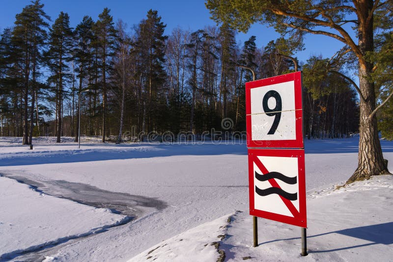 Speed Limit and Prohibition of Causing Waves Sign Next To a Frozen ...