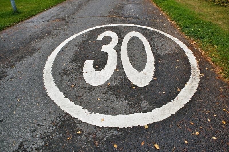 Speed Limit Sign of 30 Painted on the Ground Stock Photo - Image of ...
