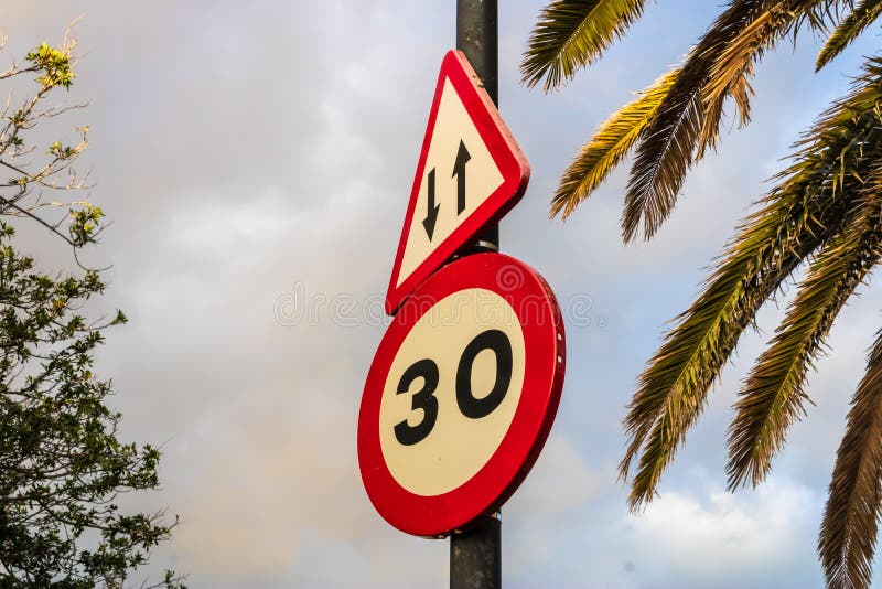 Speed Limit 30 Sign and Regulation Road Sign with the Trees on the ...