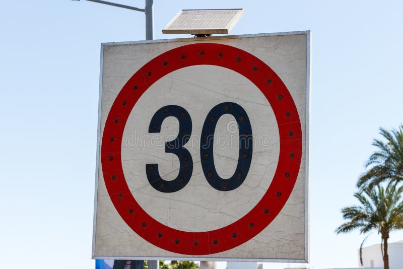 Speed Limit Sign To 30 with Solar Panel on the Road Stock Photo - Image ...