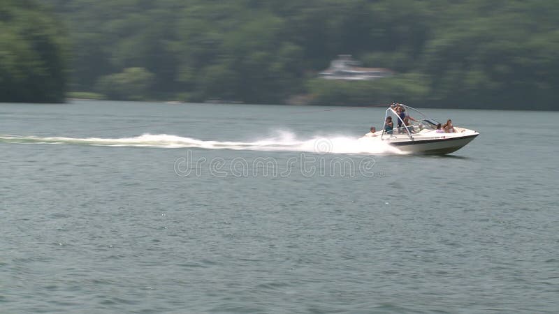 Speedboat pulling a float stock footage. Video of sail - 64521024