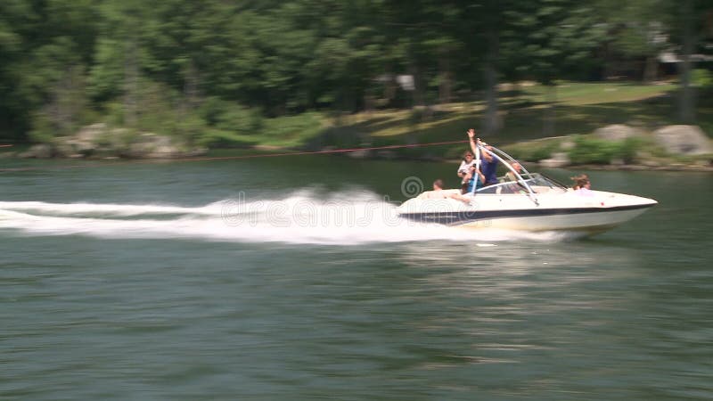 Speedboat pulling a float stock footage. Video of sail - 64521024