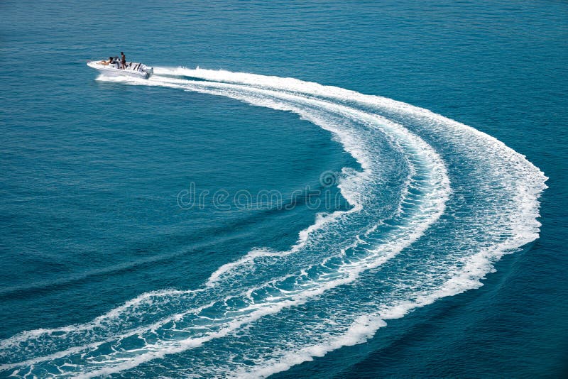 Speedboat Runs Fast in the Open Sea and Leaves the Engine`s Wake in the ...