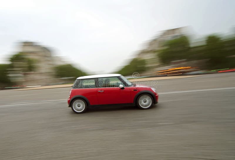 Speeding car (Mini Cooper) stock image. Image of commuting - 14508305