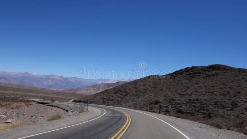 Speeding Down the Winding and Empty Asphalt Road in the Middle of the ... Speeding Down the Winding and Empty Asphalt Road in the Middle of the ...