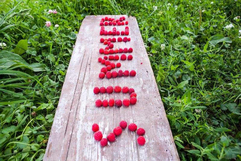 Spell of Ripe Raspberries on Board Stock Image - Image of spell, grass ...
