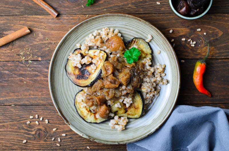 Spelt with Onion Chutney and Grilled Eggplant on a Plate Stock Photo ...