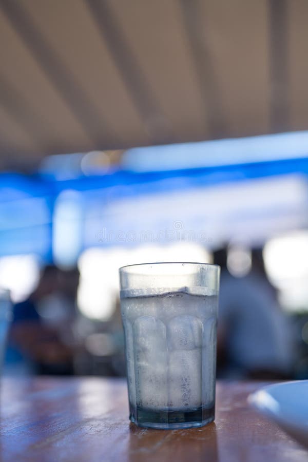 Sphere Glass with Ice Cubes and Water on Table Stock Image - Image of ...