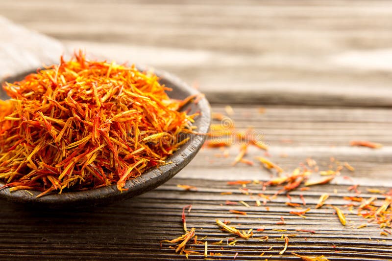 Spice Saffron in a Wooden Spoon on the Table. Stock Photo - Image of ...