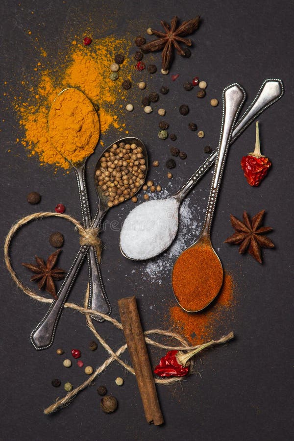 Spices on a Black Background. Spoons with Different Spices on a Dark ...