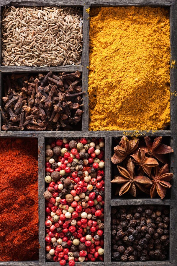 Spices in Box: Pink and Black Pepper, Ground Paprika, Curry, Anise ...