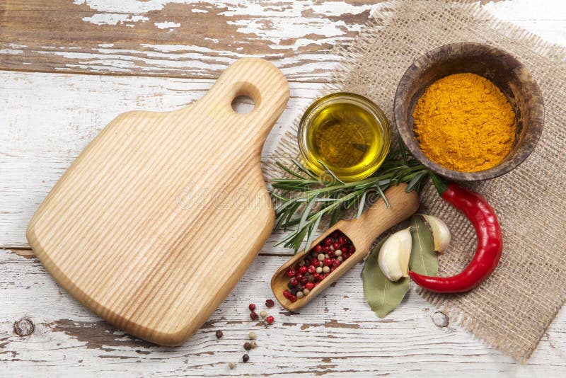 Spices with cutting board stock image. Image of ingredient - 52645587