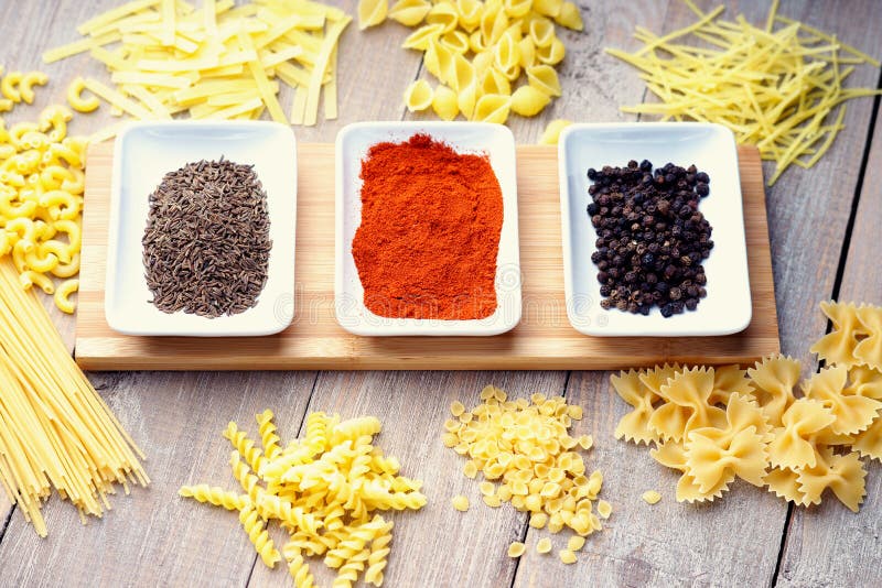Spices and pasta stock image. Image of yellow, wood, caraway - 68069619