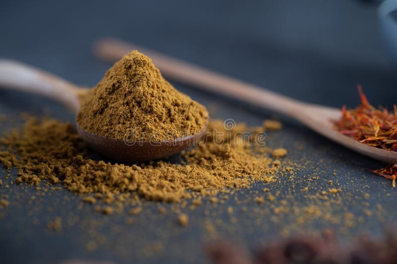 Spices are Placed in a Spoon and Placed on the Cement Ground Stock ...