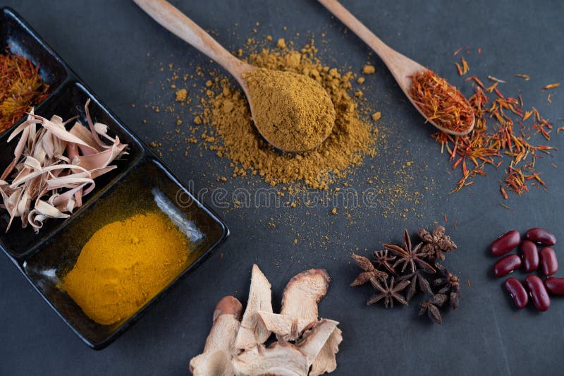 The Spices are Placed in a Spoon and Placed in a Cup on the Cement ...