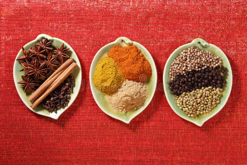 Spices in Three Leaf Shape Plates on Glitter Red Stock Photo - Image of ...