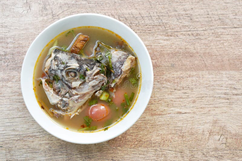 Spicy Boiled Tilapia Head Fish in Tom Yum Soup on Bowl Stock Image ...