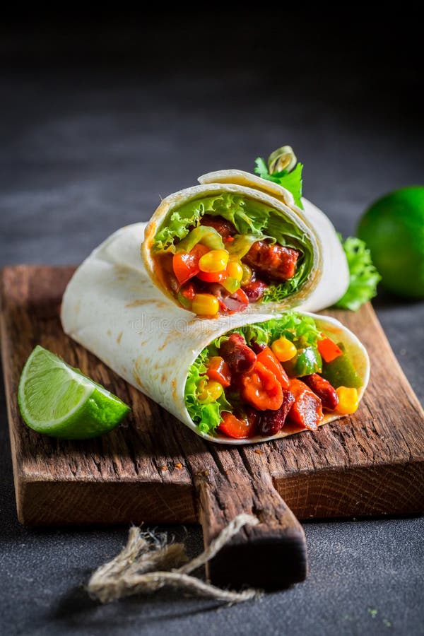 Spicy Burrito with Red Salsa, Lettuce and Vegetables Stock Image ...