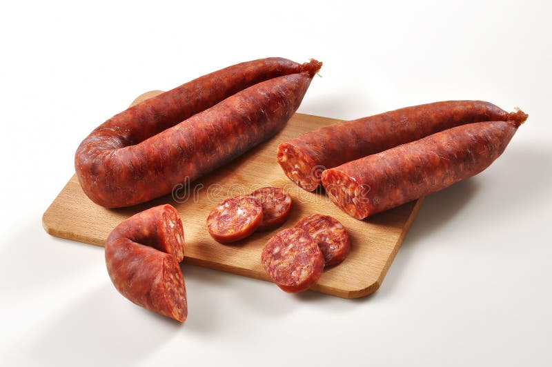 Spicy Calabrese Salami on Cutting Board Stock Photo - Image of salami ...
