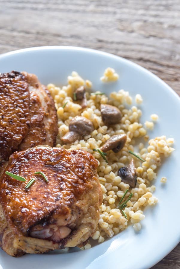Spicy Chicken with Bulgur and Mushrooms Stock Photo - Image of green ...