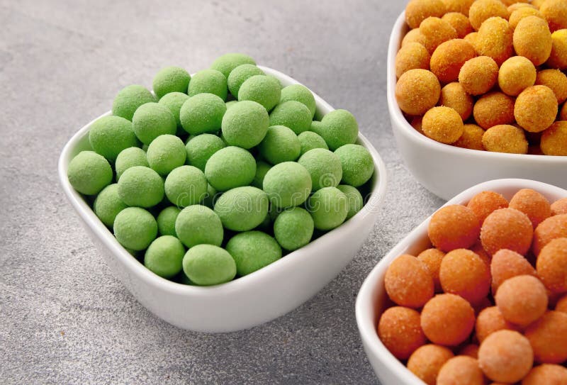 Spicy Coated Fried Peanuts on Gray Background. Snacks and Nuts Stock ...