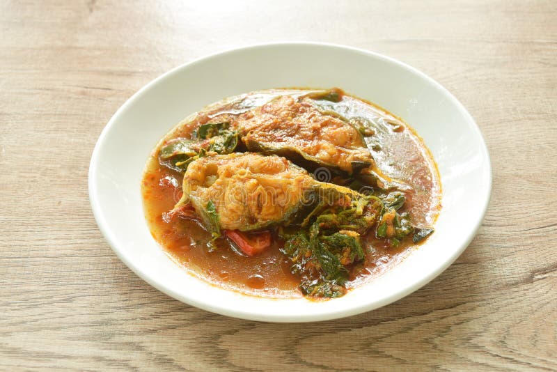 Spicy Fried Catfish with Basil and Chili in Curry on Plate Stock Image ...