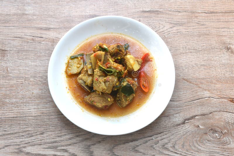 Spicy Fried Pork Soft Bone with Curry and Basil on Plate Stock Photo ...