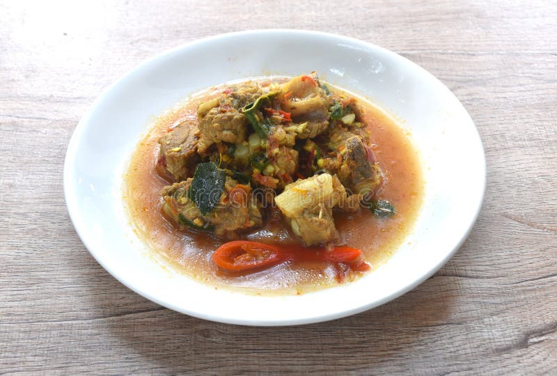 Spicy Fried Pork Soft Bone with Curry and Basil on Plate Stock Image ...