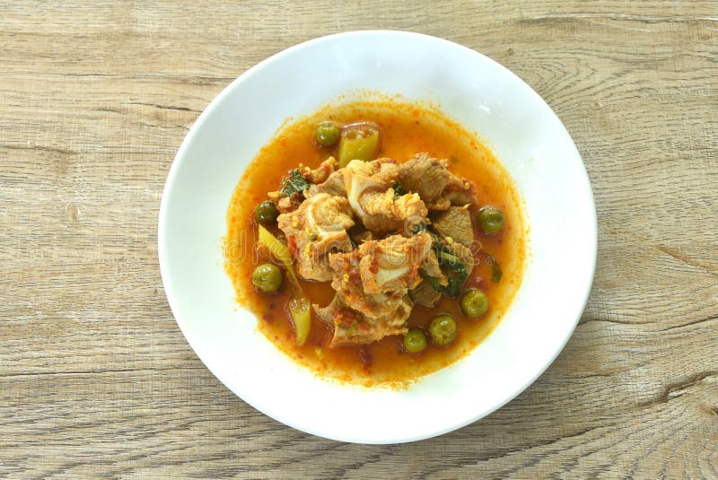 Spicy Fried Pork Soft Bone with Curry and Eggplant on Plate Stock Photo ...