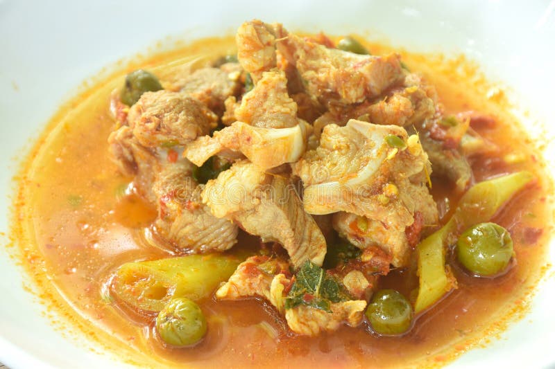 Spicy Fried Pork Soft Bone with Curry and Eggplant on Plate Stock Photo ...
