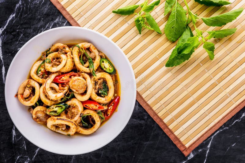 Spicy Fried Squid with Basil Leaves Stock Photo - Image of herb, dish ...