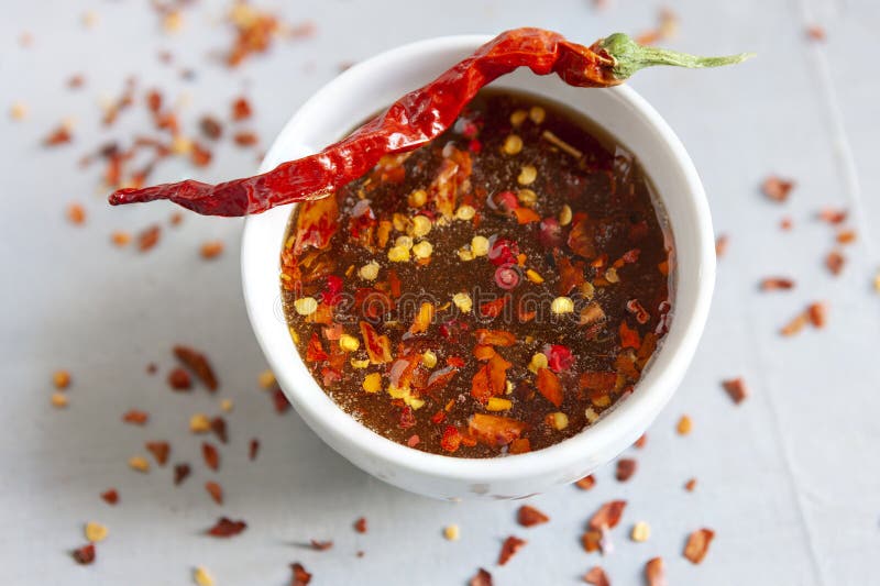 Spicy or Hot Chilli Honey in the Bowl with Dry Chilli Pepper Stock ...