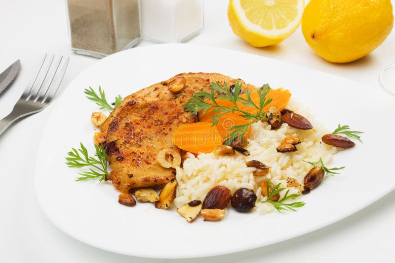 Spicy Pork Steaks with Roasted Nuts and Rice Stock Image - Image of ...