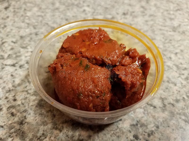 Spicy Red Pepper Paste in Small Plastic Container on Counter Stock ...