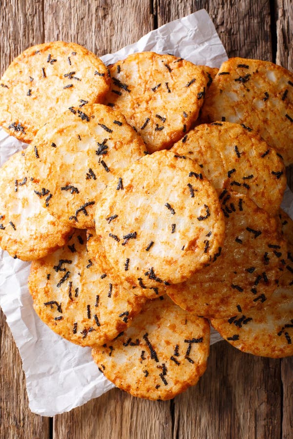 Spicy Rice Cracker with Seaweed Macro on the Table. Vertical Top Stock ...