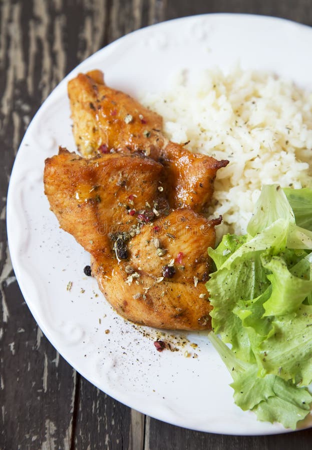 Spicy Roasted Chicken Breast with Rice and Lettuce Stock Image - Image ...