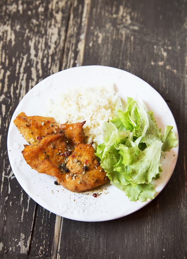Spicy Roasted Chicken Breast with Rice and Lettuce Stock Photo - Image ...