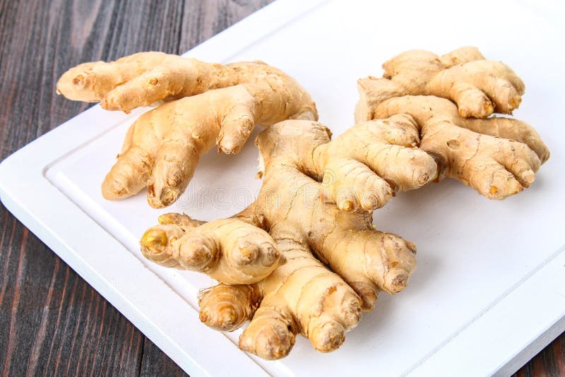 Spicy Root of Ginger on a Wooden Table. Stock Image - Image of close ...