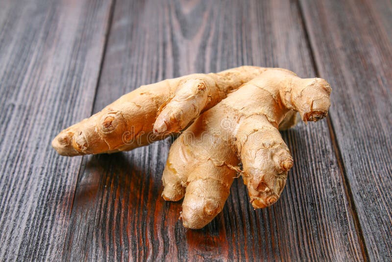 Spicy Root of Ginger on a Wooden Table. Stock Image - Image of ...